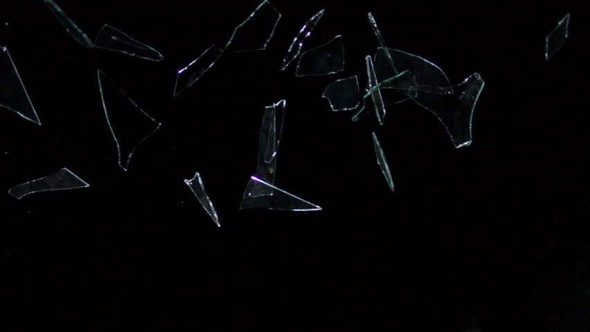 Overlapping Broken Glass Shards And Fragments Isolated On Black Falling In Slow Motion In 4k