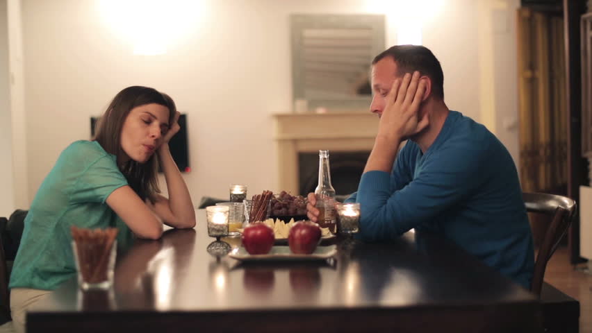 Offended Bored Couple Sitting By The Table In Restaurant Stock Footage