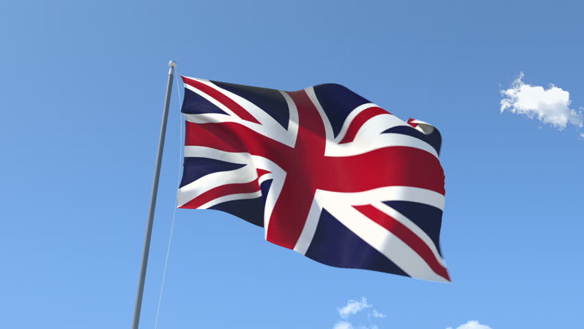British Flag Waving In Wind Against Clear Blue Sky Stock Footage Video ...