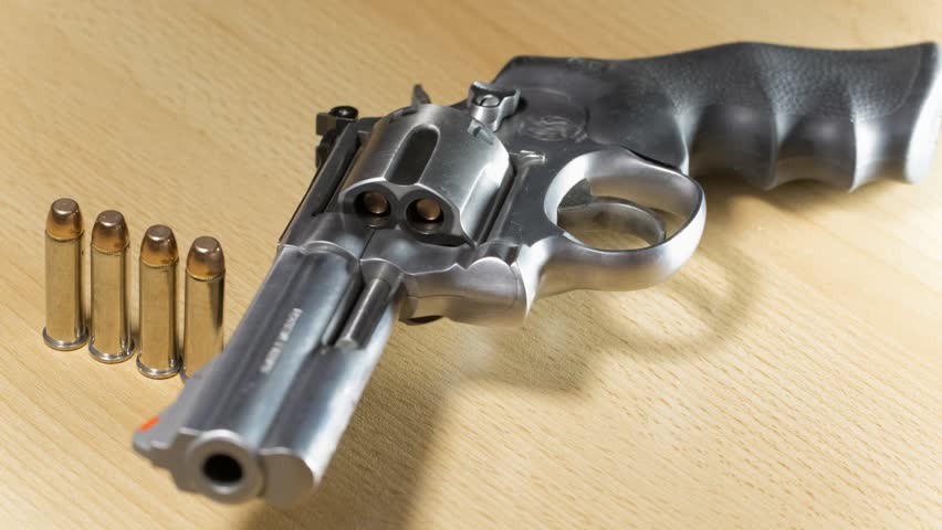 Close Up Of A Loaded Revolver With Open Cylinder Showing The Bullets In ...