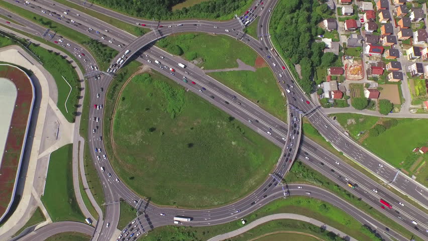 AERIAL: Flying Above Huge Roundabout Full Of Cars And Trucks At Rush ...