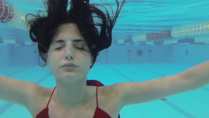 SLOW MOTION: Woman Wearing Red Dress Portrait Inside Swimming Pool ...