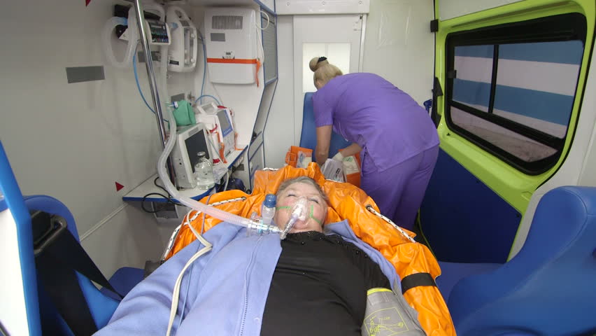 Paramedic Provide Emergency Medical Care To Critical Patient In ...