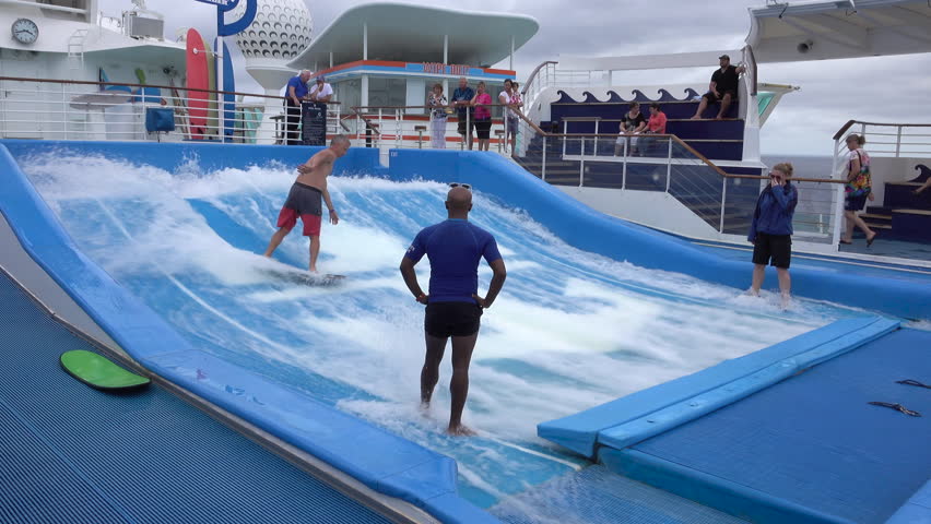 Cruise Ship Recreation Surfing In Wave Pool. Fun And Recreation Onboard ...