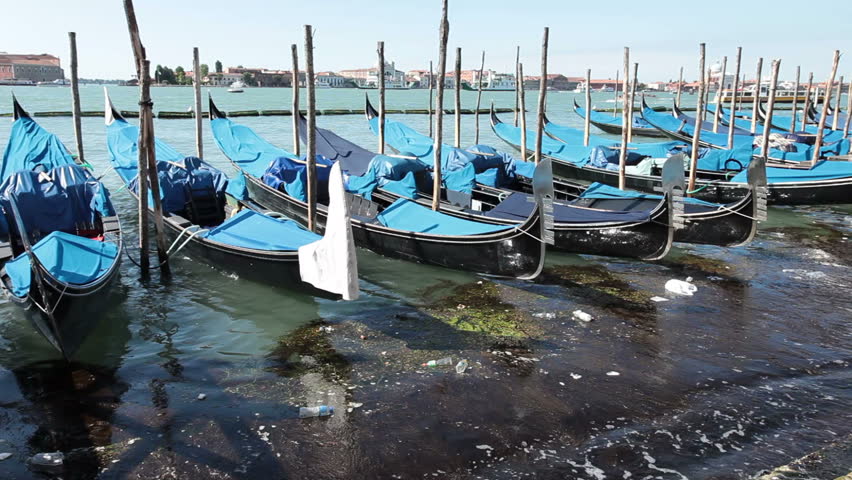 Pollution, Junk, And Filth In Water Around Beautiful Gondolas On Edge ...
