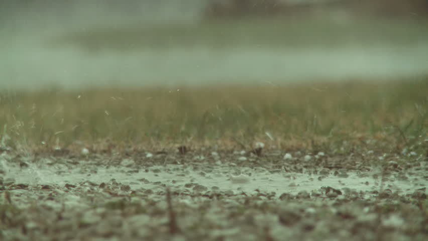 Big Drops Of Rain Hitting The Ground And Splashing During A Storm ...