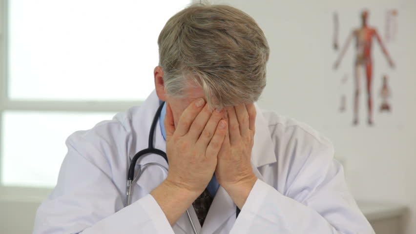 Upset Doctor With Head In Hands Stock Footage Video 4561640 - Shutterstock
