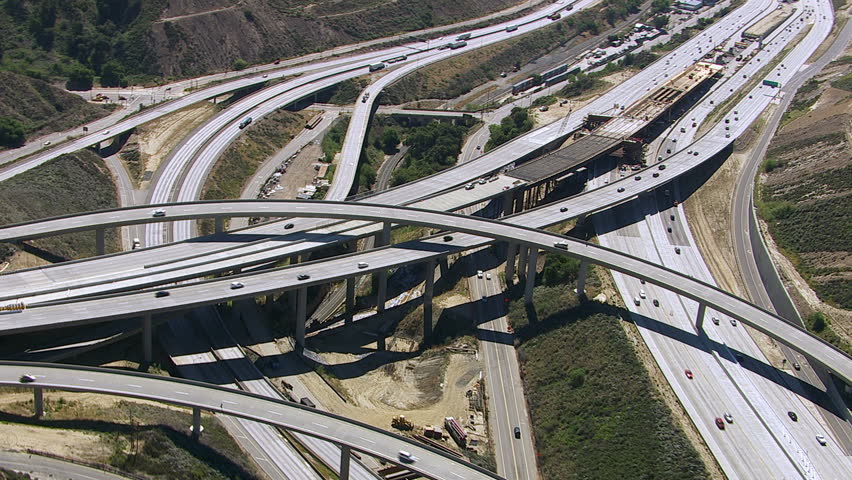 Aerial View Of Busy City Traffic At An Intersection On A Major Freeway ...