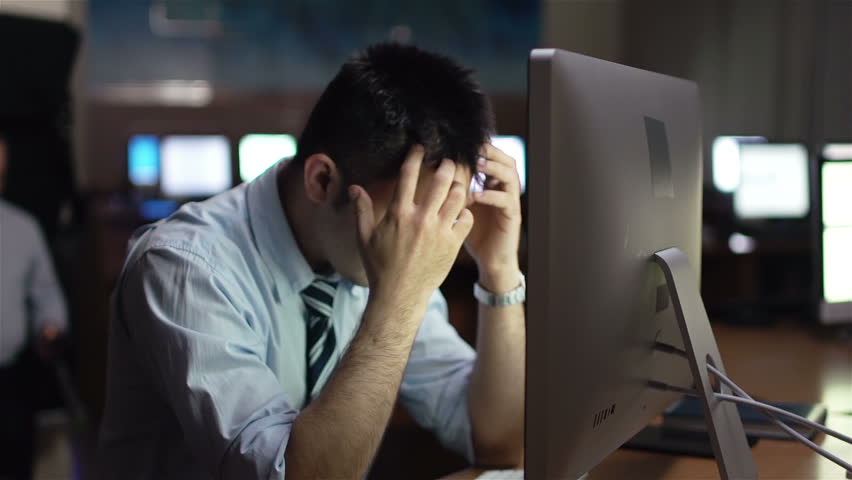 Frustrated Businessman Sitting In Front Of Computer Monitor In Office ...