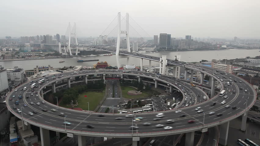 Nanpu Bridge In Shanghai Shows A Massive Roundabout, Bridge, And Heavy ...