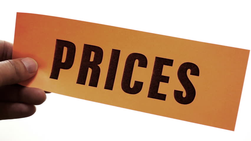 Cutting A Bright Orange Piece Of Paper With The Word Prices Printed On ...