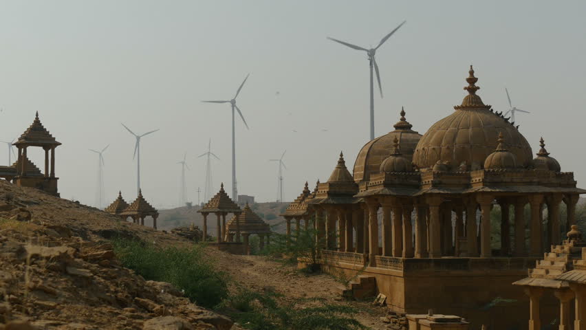 A Large Wind Farm Is Visible Behind Ancient Historical Buildings Nearby ...