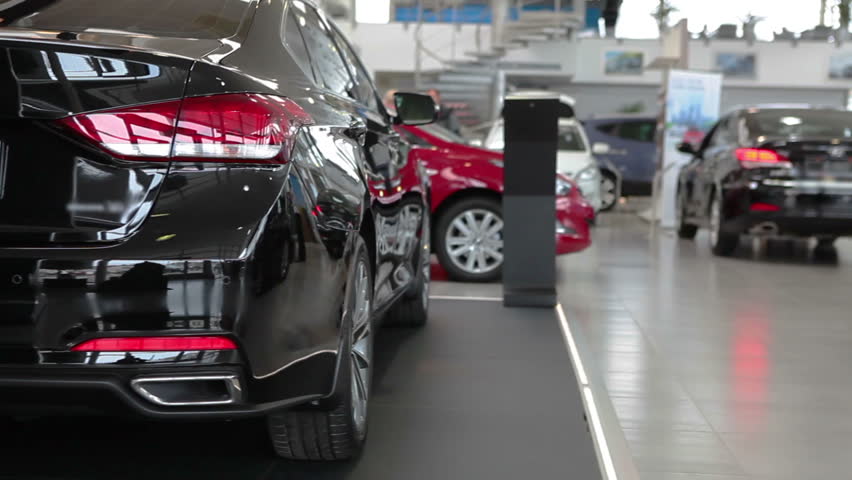 Luxury Car Dealership Showroom With Customers And Salesmen. Stock ...